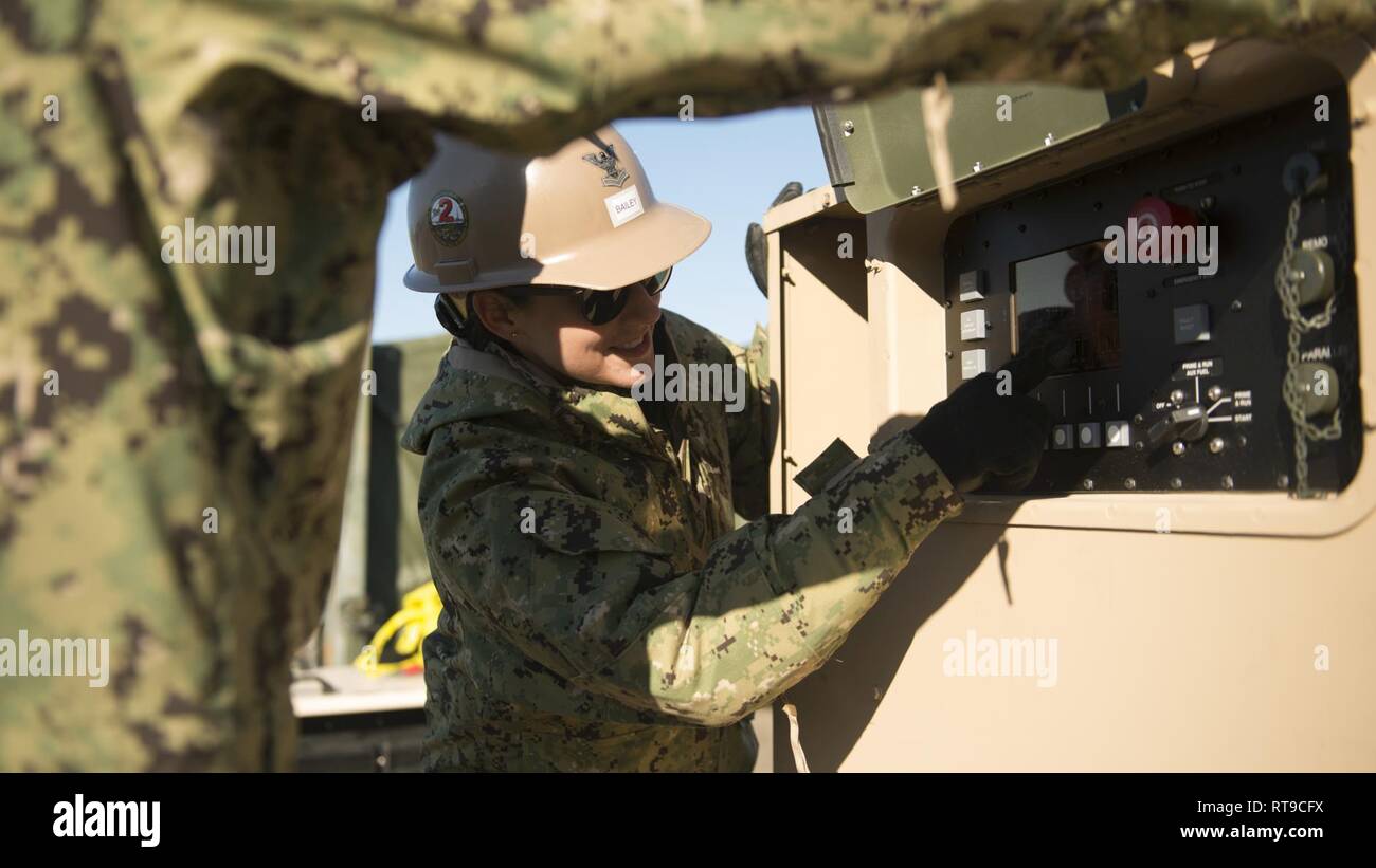 Construction Electrician 2nd Class Ashley Bailey, a Sailor assigned to ...