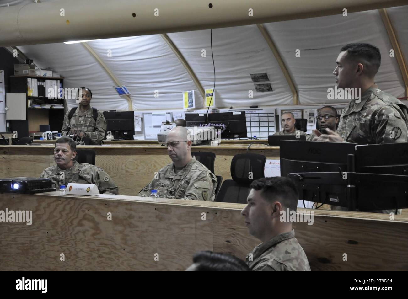 Maj. Mark Garcia, right, 524th Support Battalion, briefs Maj. Gen. Flem ...