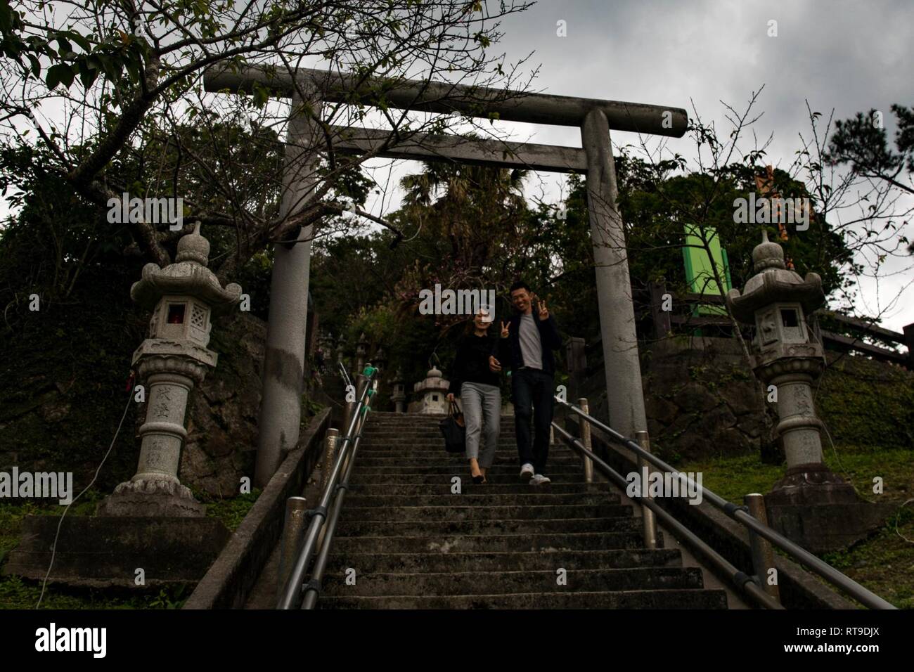 Okinawan residents walk down steps during the Nago City 50th Annual ...