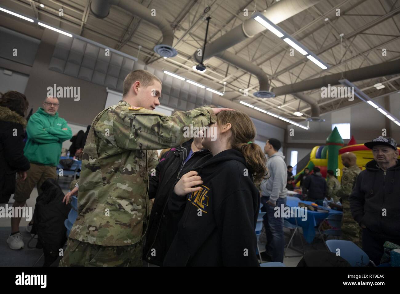 U.S. Army Spc. Colin Williams says goodbye to his sister Kayla during a ...