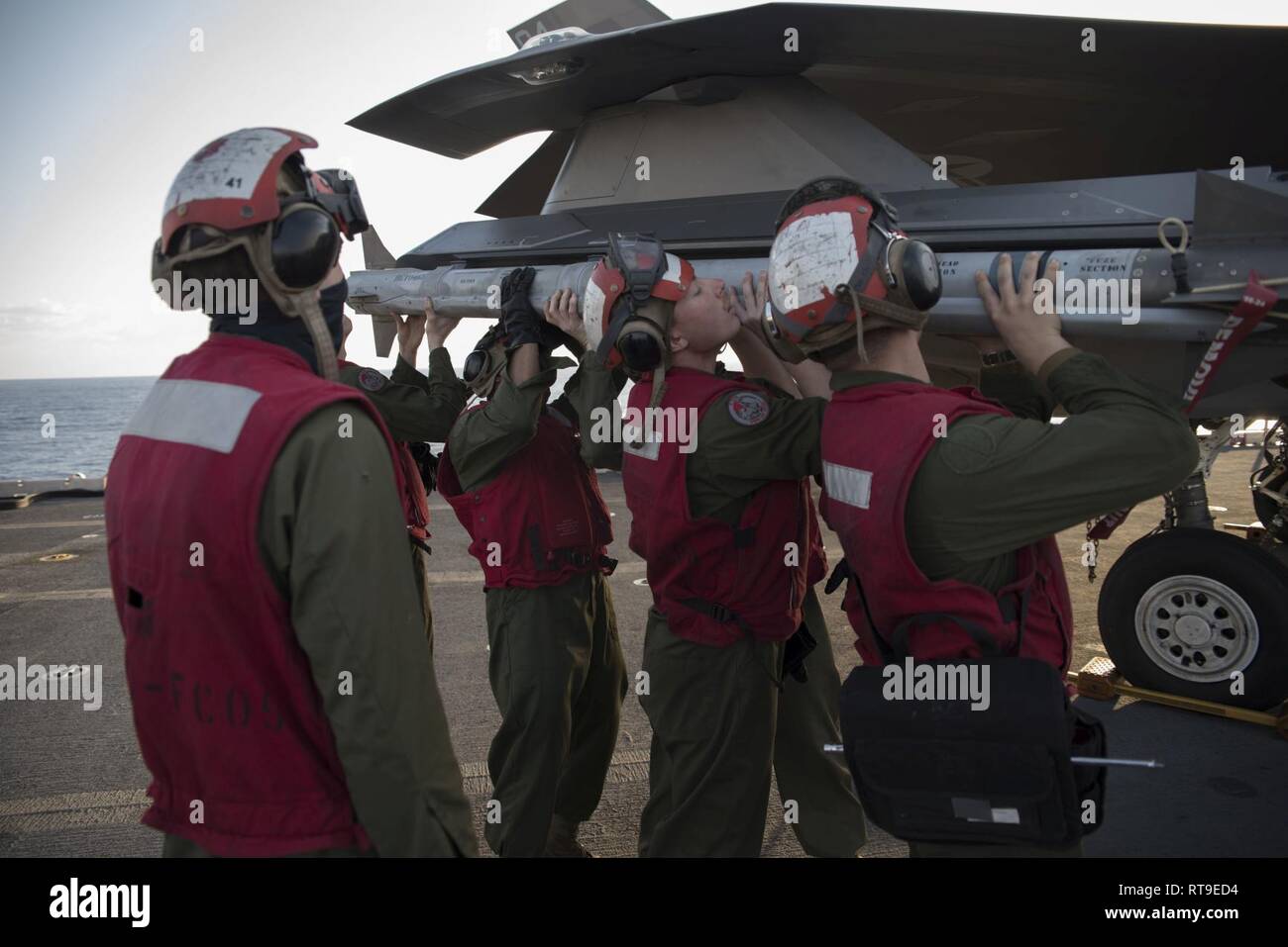 PHILIPPINE SEA (Jan 28, 2019) -- Marines load a Captive Air Training ...