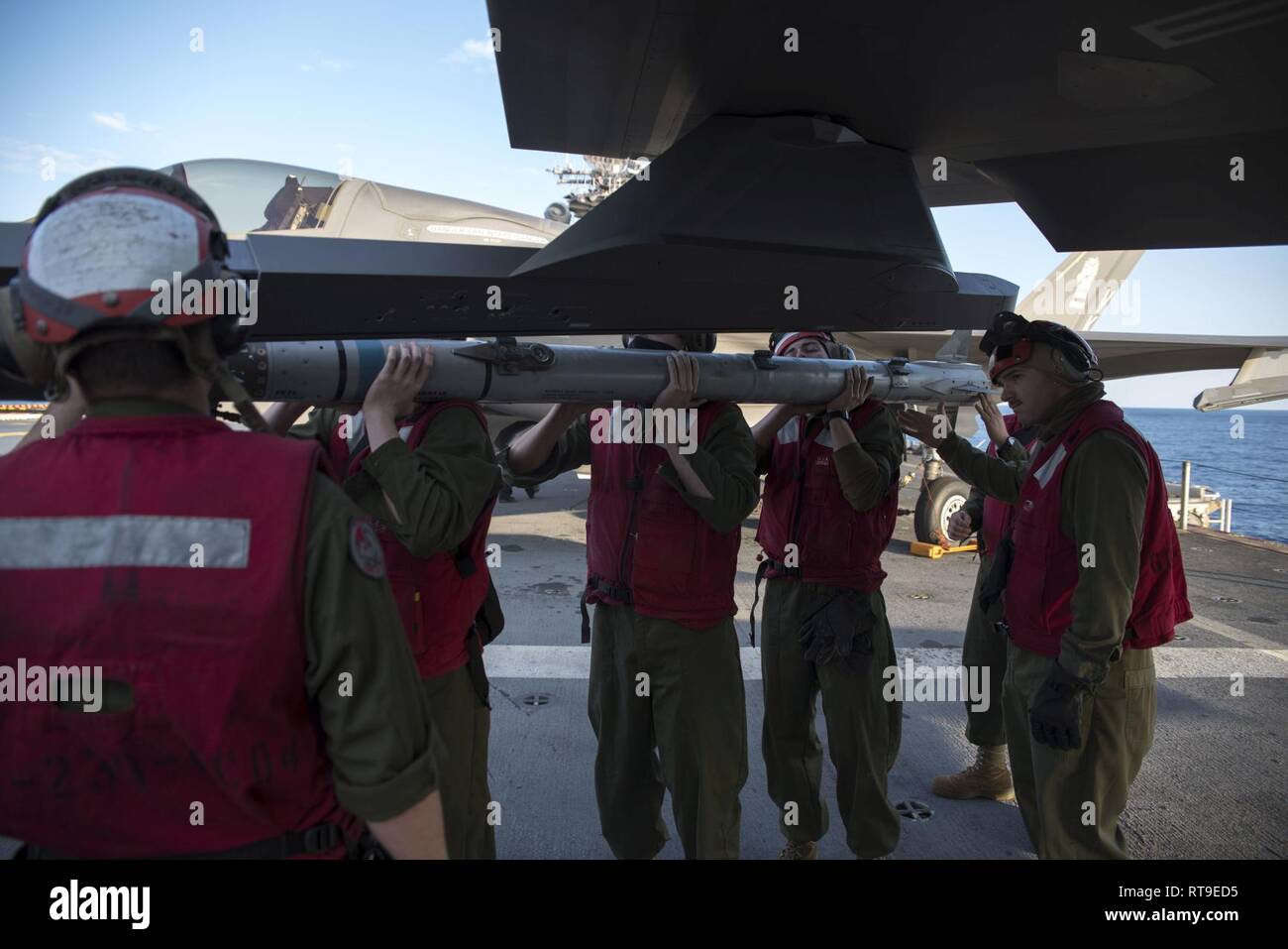 PHILIPPINE SEA (Jan 28, 2019) -- Marines load a Captive Air Training ...