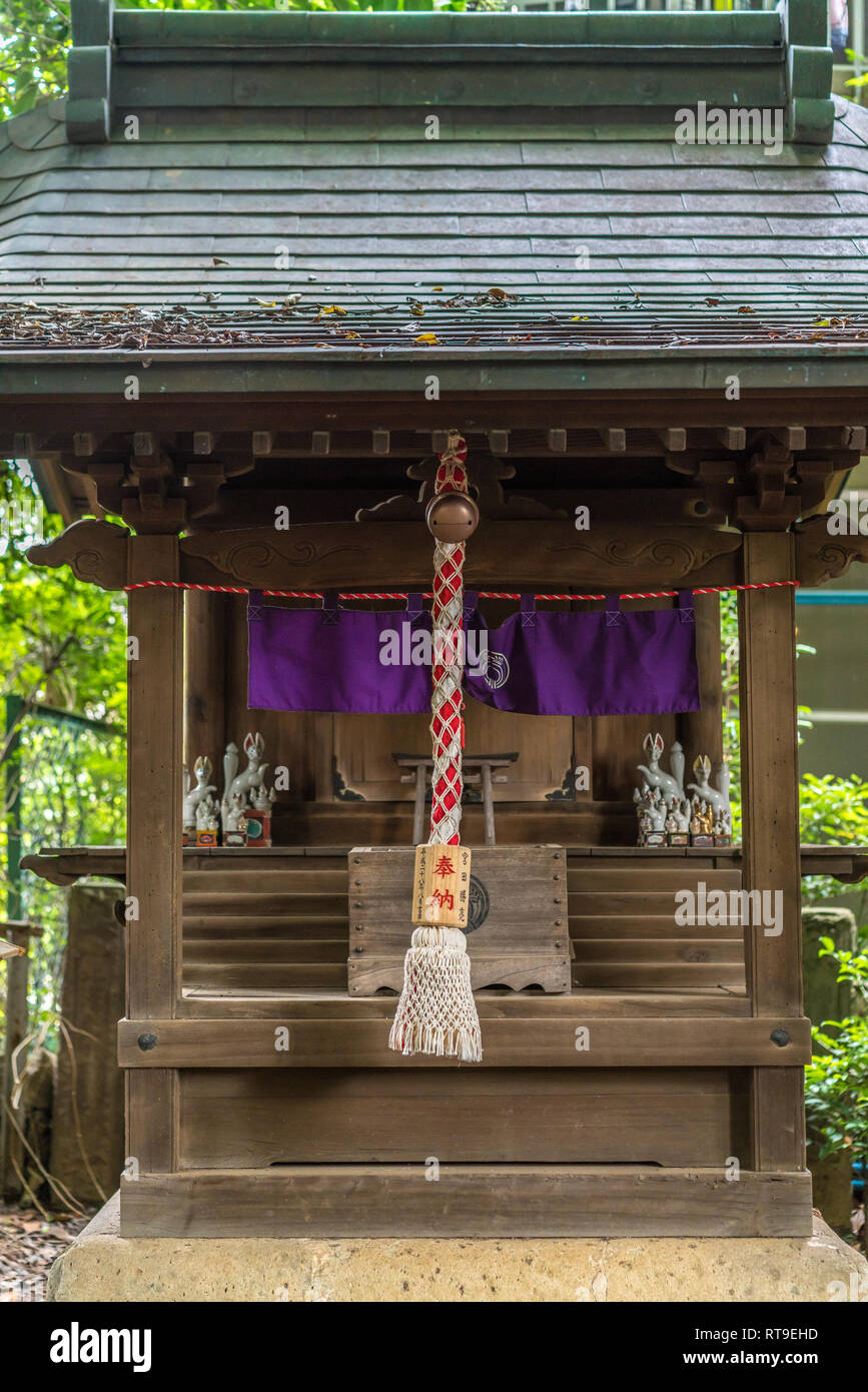 Setagaya, Tokyo, Japan - August 19, 2017: Noyashiki Inari Sha, Small shinto shrine located ...