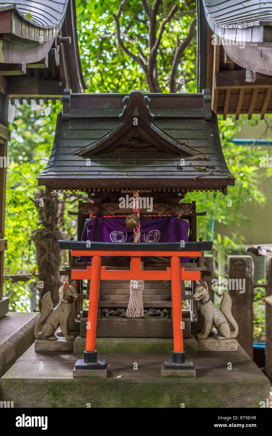 Setagaya, Tokyo, Japan - August 19, 2017: Atago Inari Sha. Small shinto shrine located inside ...