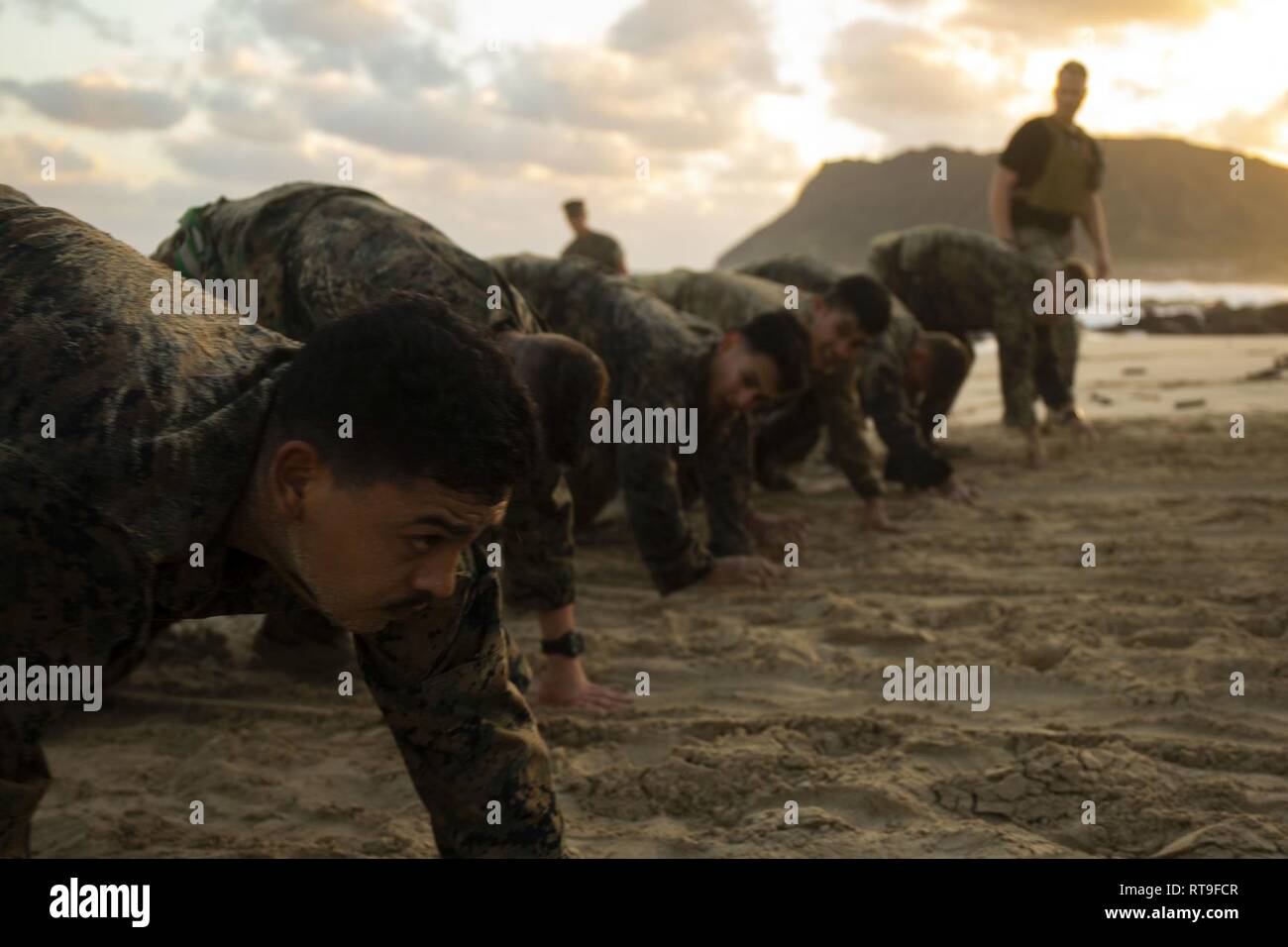 U.S. Marine Corps Cpl. Melvin Paniagua leads the way in a physical ...