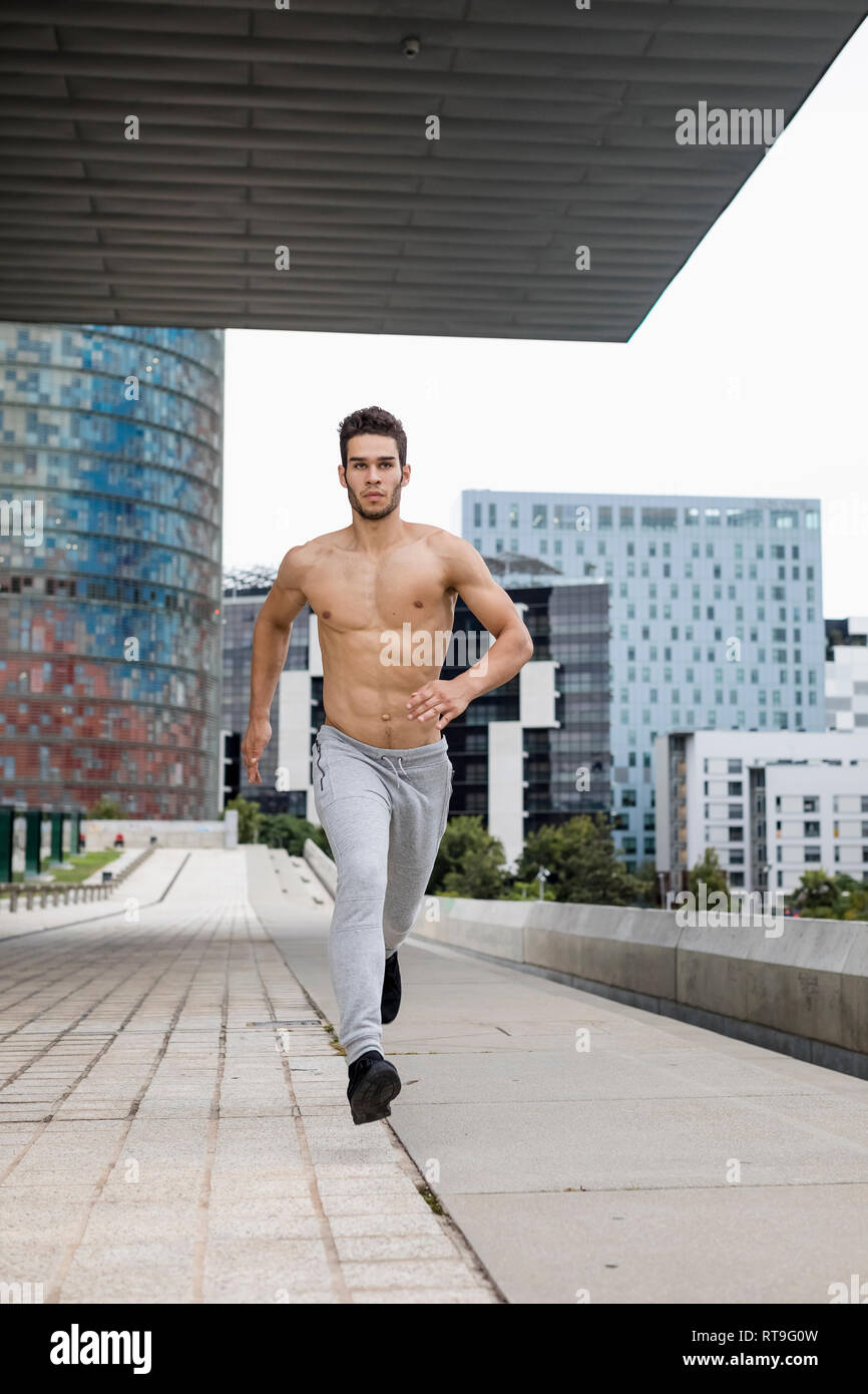 Young man jogging outdoor Stock Photo - Alamy