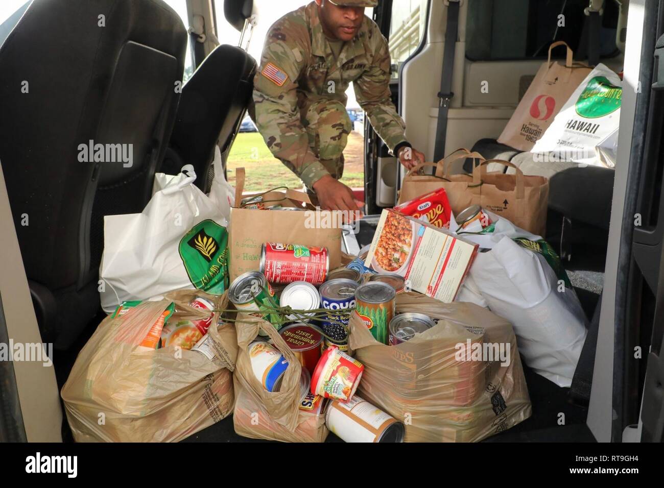 Master Sgt. Tronh Colley, 524th CSSB Command Sergeant Major helps ...