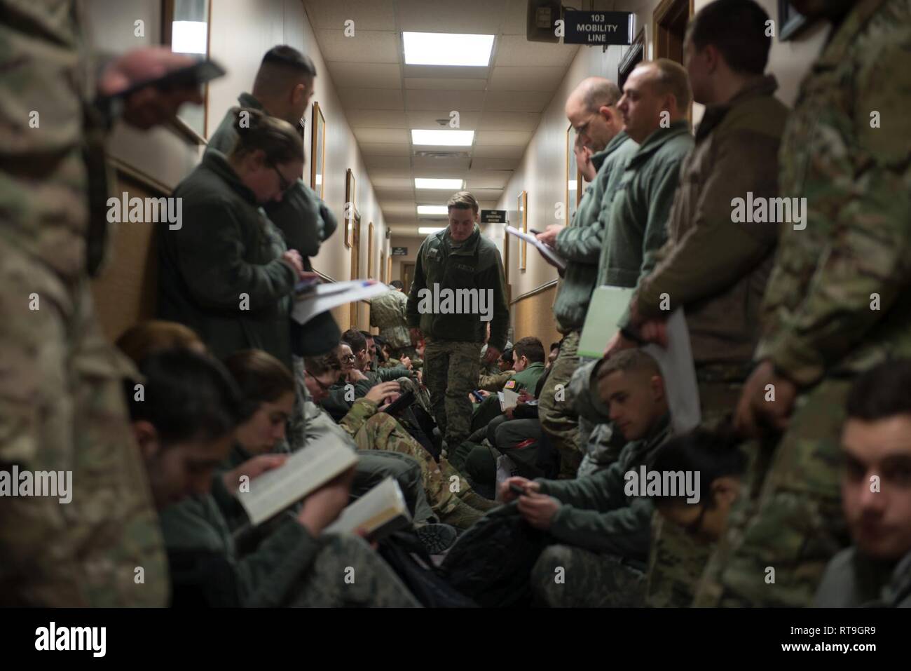 Members of Team Offutt line the walls of the Installation Deployment ...