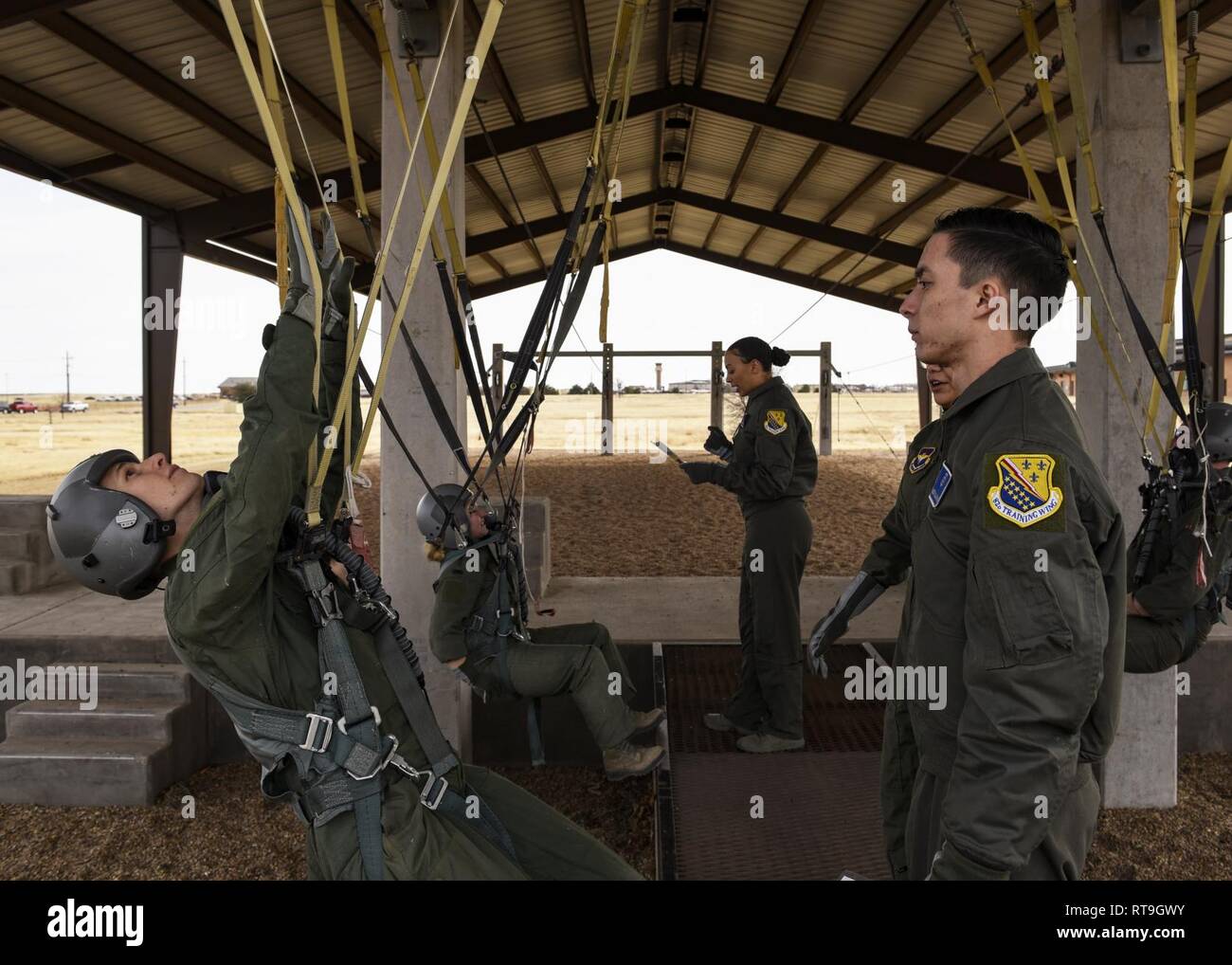 Pilot Training Next program students, left, simulate being in a ...