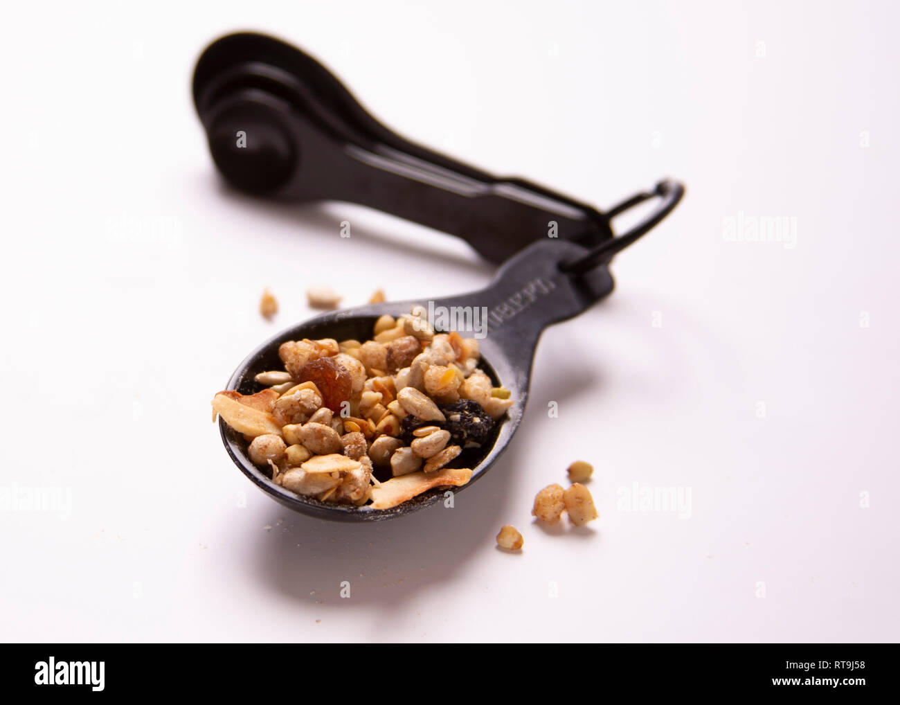 One tablespoon of food. Portion control. Buckwheat muesli Stock Photo ...