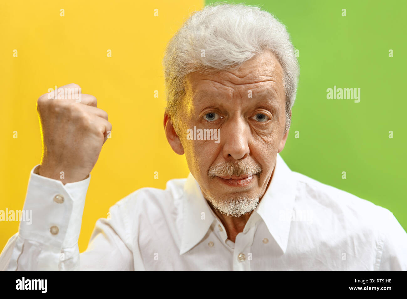 Screaming, hate, rage. Crying emotional angry man screaming on studio ...