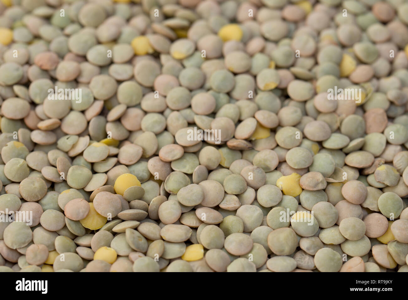raw green lentil seeds macro background Stock Photo - Alamy