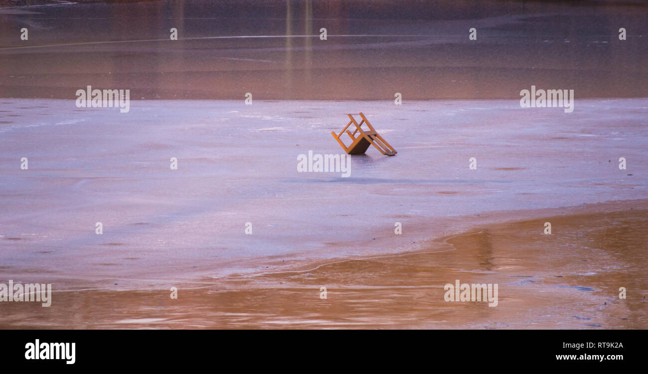 A chair on ice. a normal day in bamberg Stock Photo - Alamy