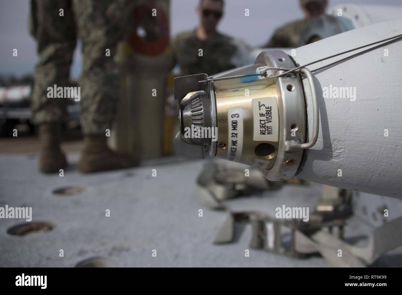 Sailors from Navy Munitions Command Atlantic Unit Charleston prepare inert marine mines at ...