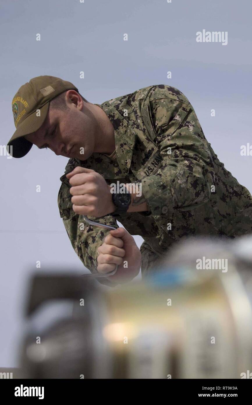U.S. Navy Petty Officer Dylan Scott, a mineman with Navy Munitions ...