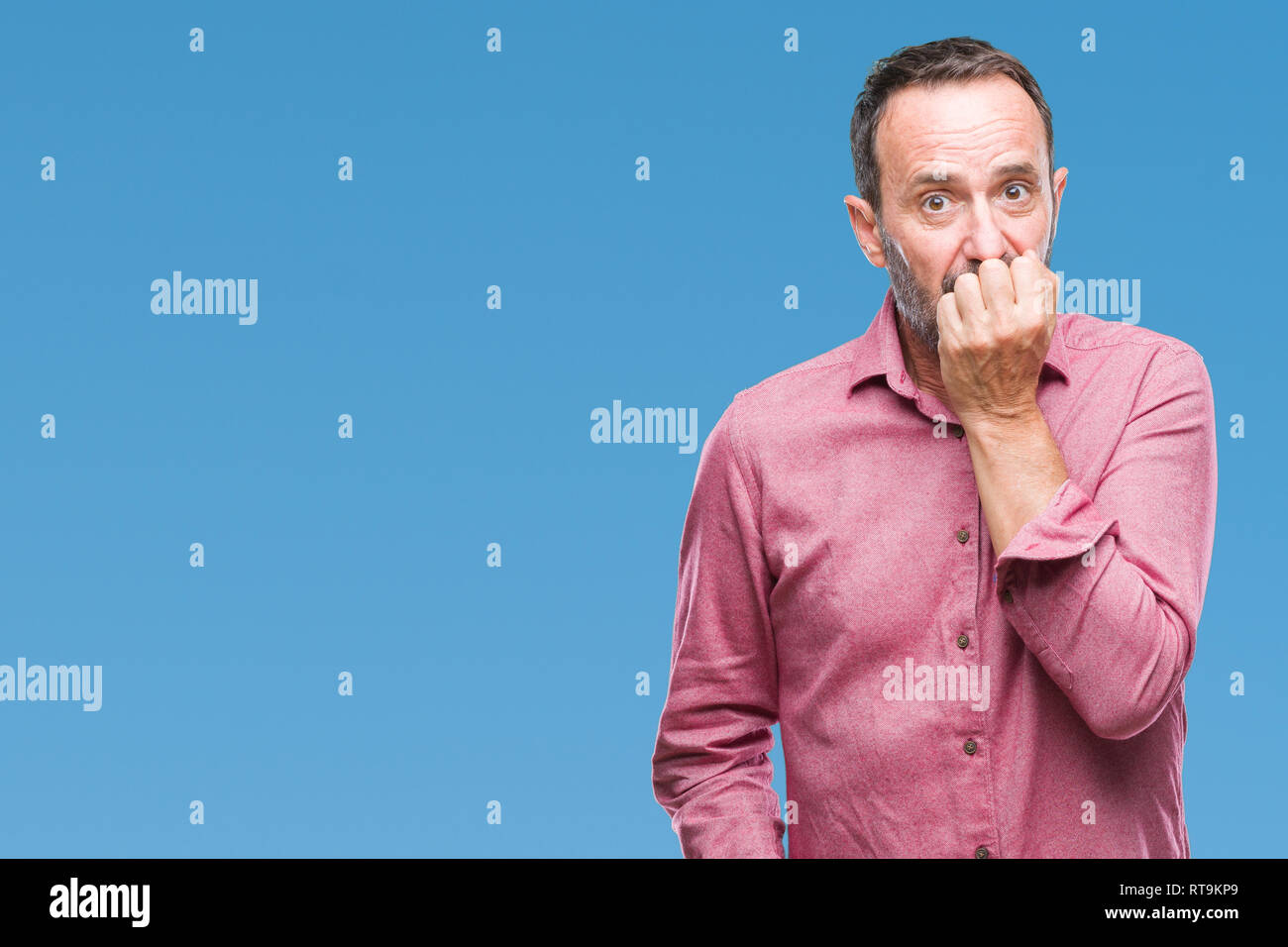 Middle age hoary senior man over isolated background looking stressed ...