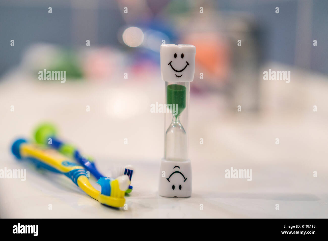 Concept of recommended time to brush your teeth. Soft focus. Two ...