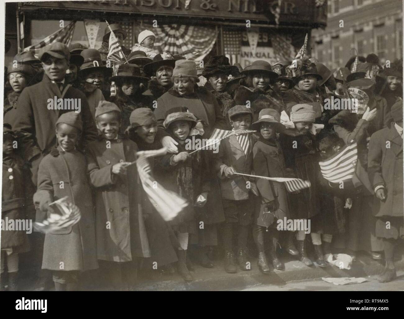 Children wait to cheer the Soldiers of the 369th Infantry Regiment as ...