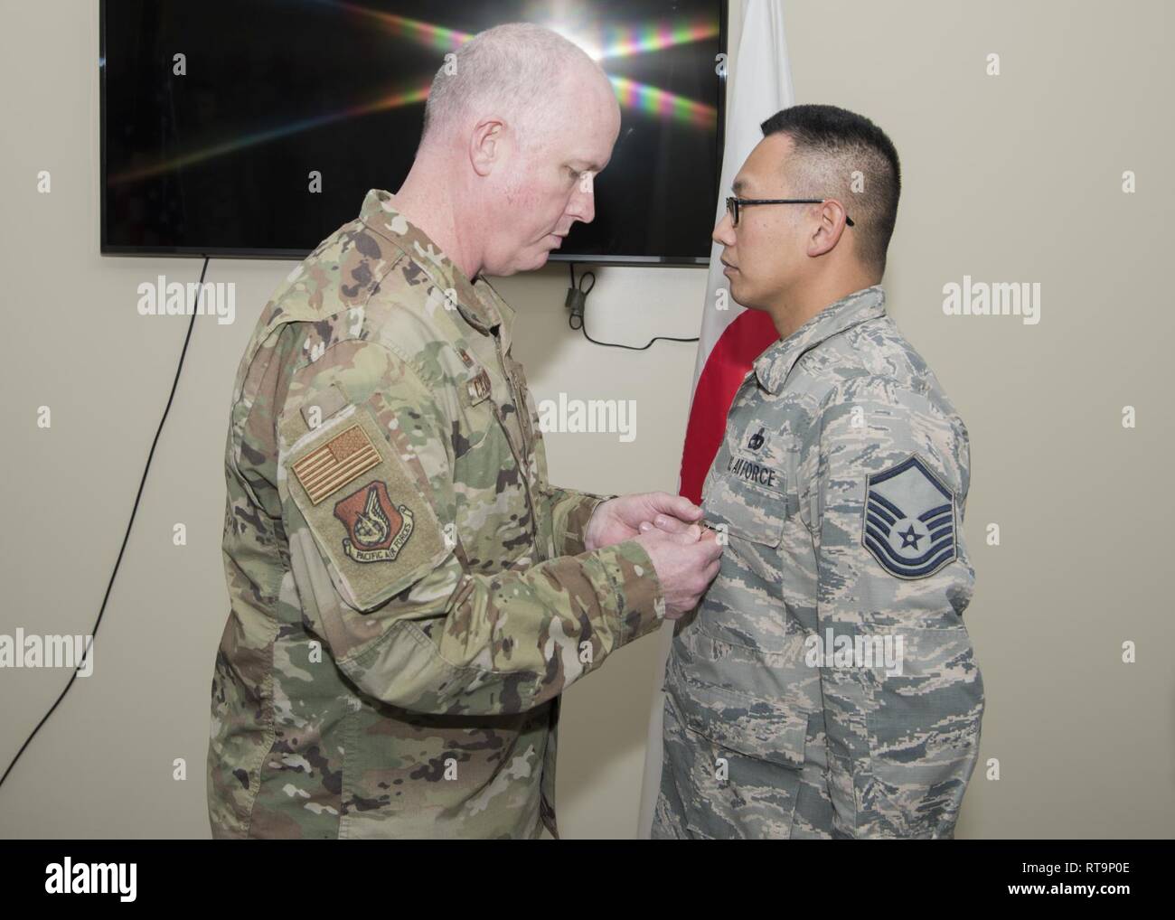 Airmen with the 35 Logistic Readiness Squadron receive a medal at ...