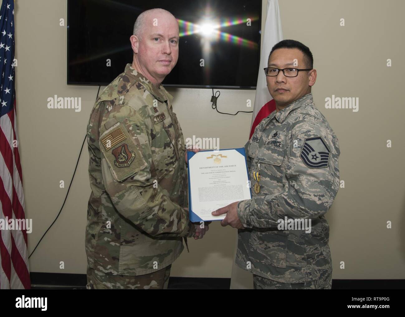 Airmen with the 35 Logistic Readiness Squadron receive a medal at ...