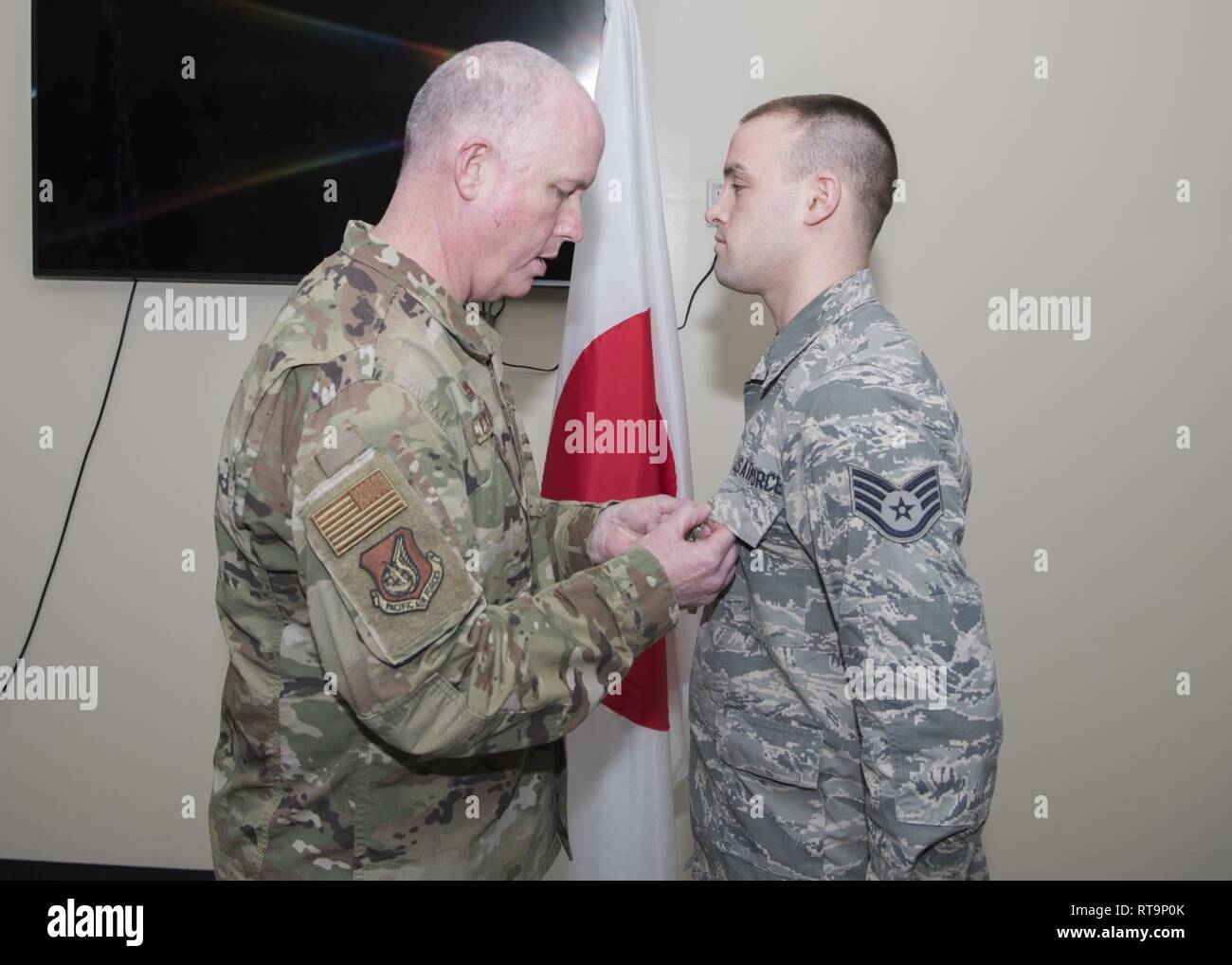 Airmen with the 35 Logistic Readiness Squadron receive a medal at ...