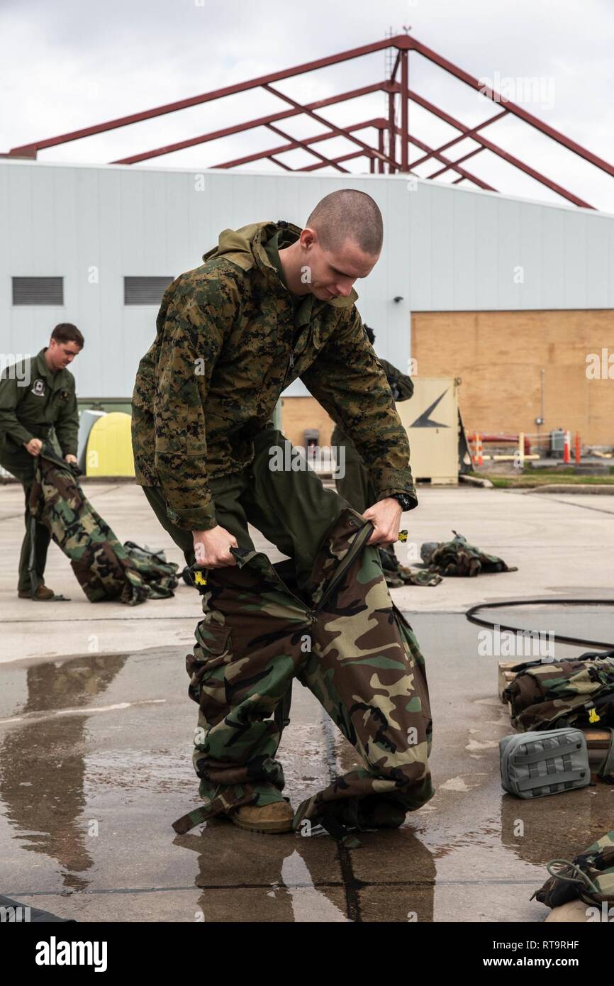 U.S. Marine Corps Lance Cpl. Tristan Mcnally dons a mission oriented ...