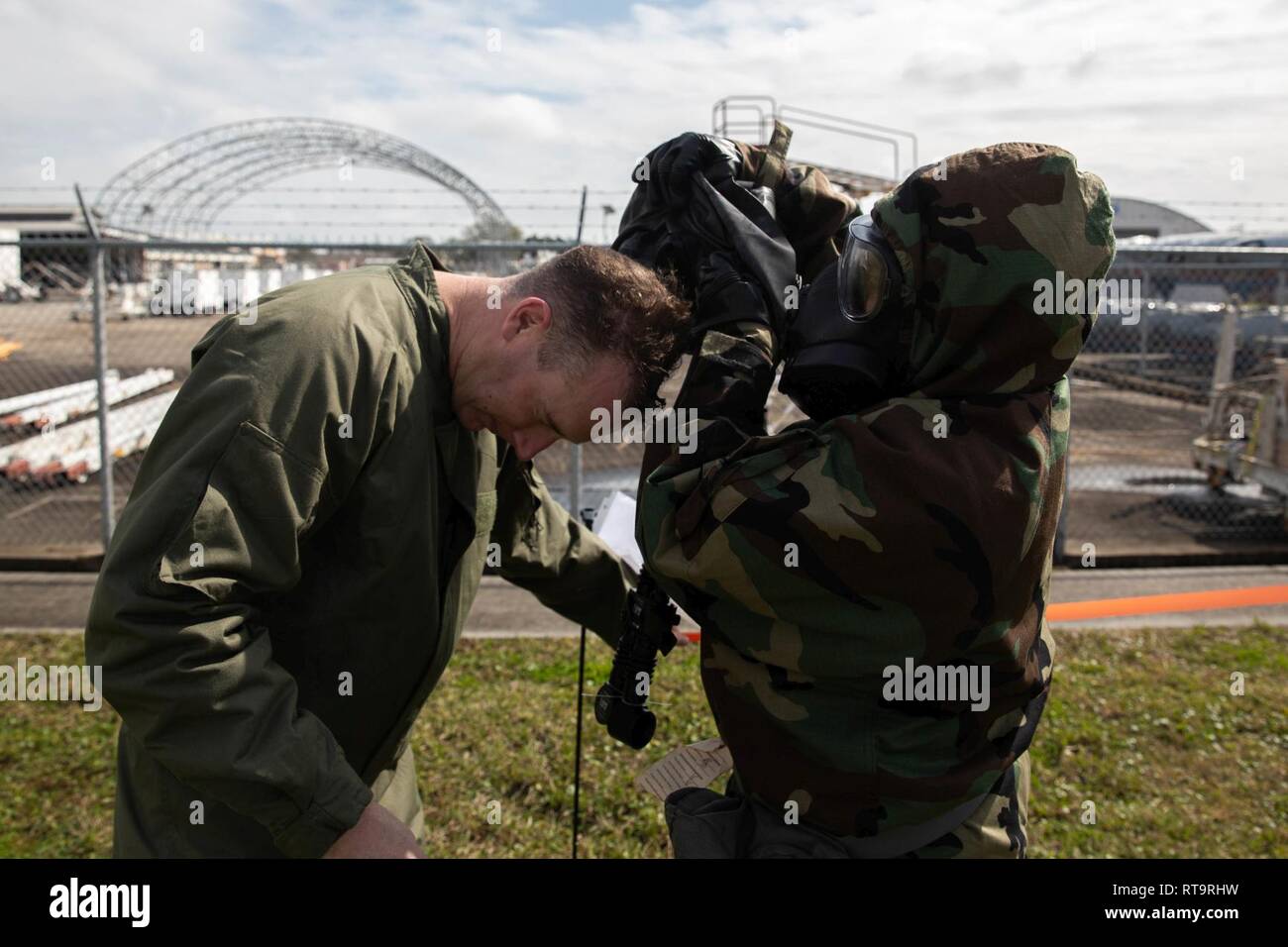 U.S. Marine Corps Lance Cpl. Tamia Williams takes off Maj. Nicholas ...