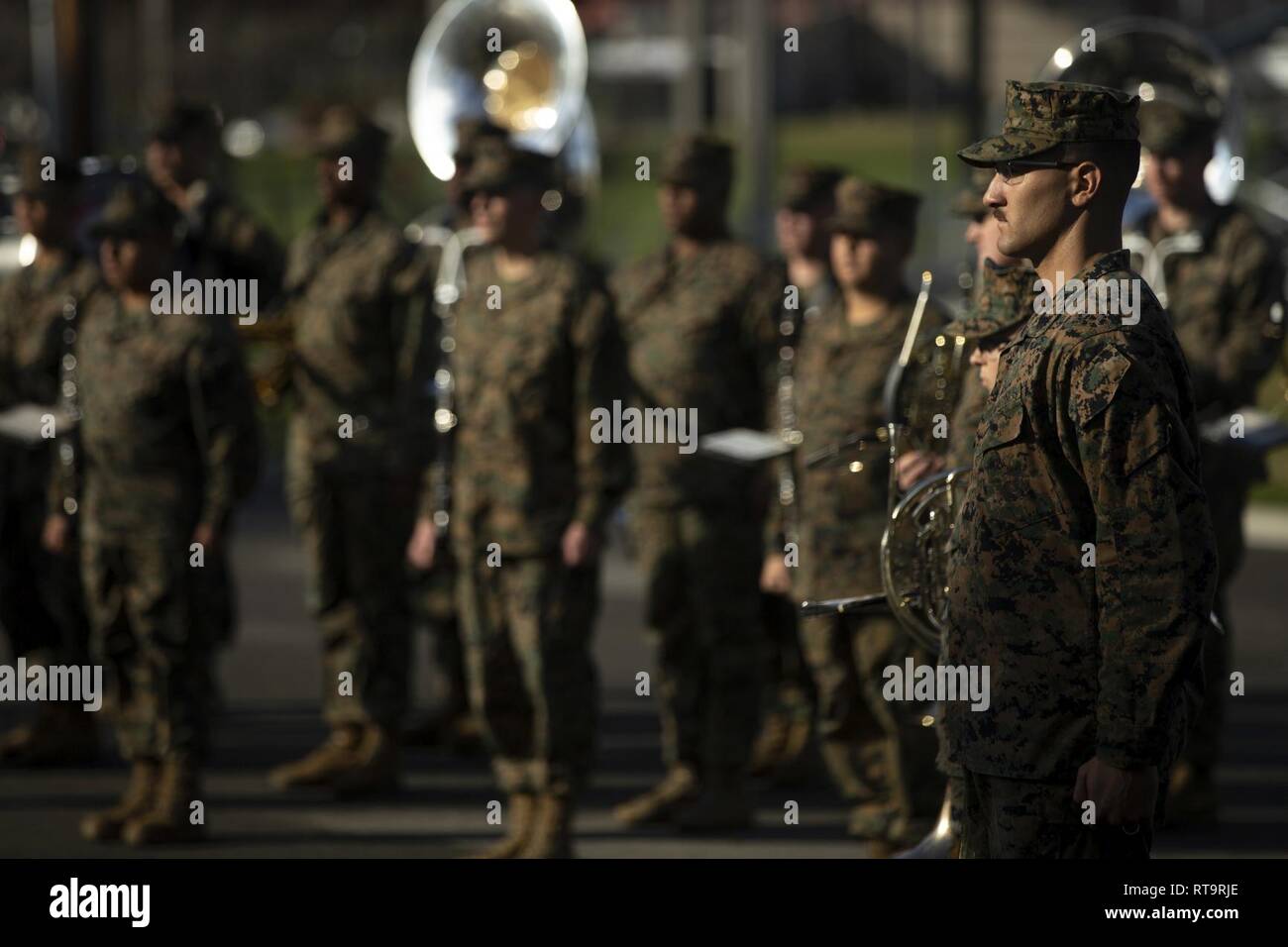 U.S. Marines with the 1st Marine Division (MARDIV) band play during the ...