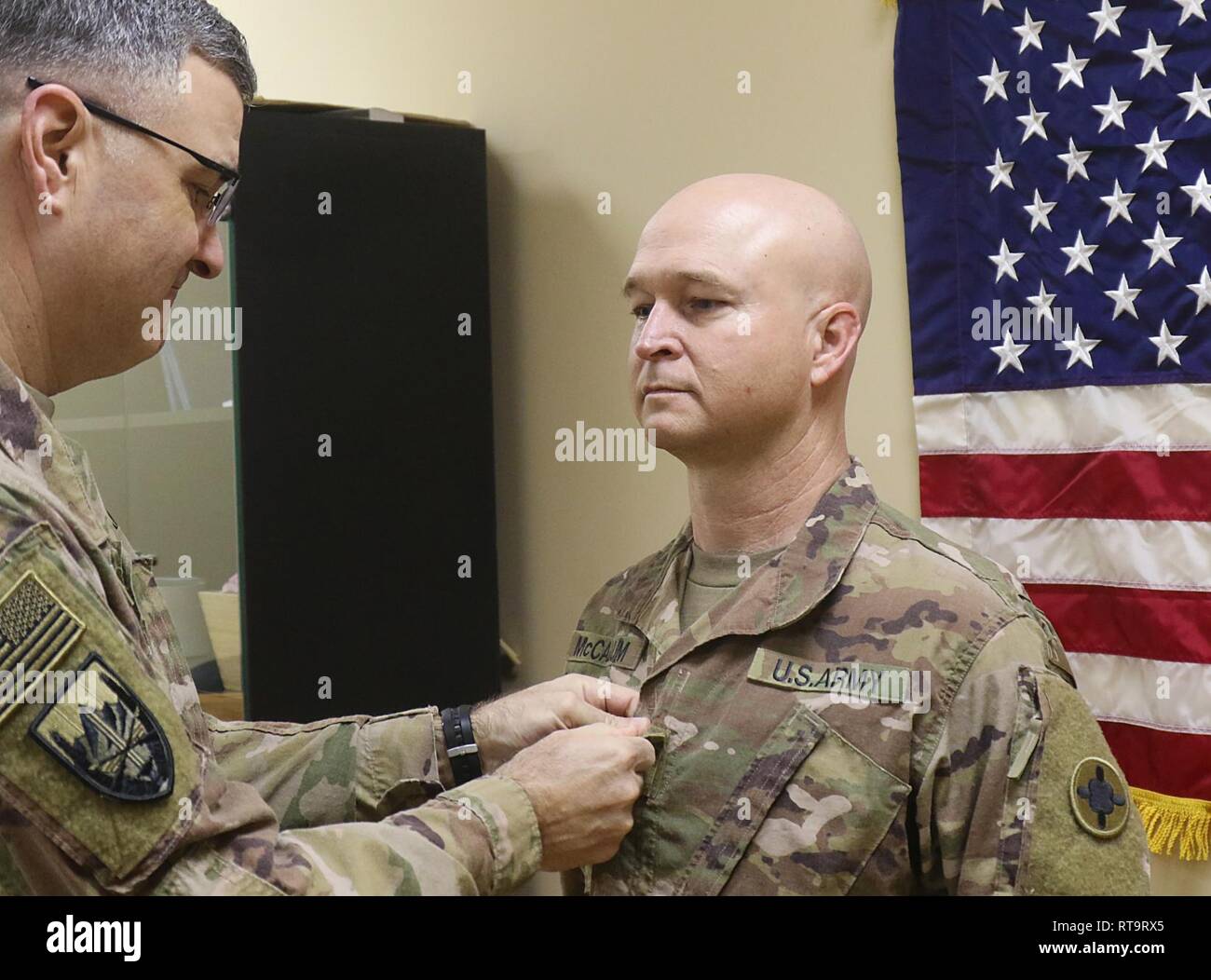 Hugh Mccallum receives his colonel rank from Brig. Gen. Clint Walker ...
