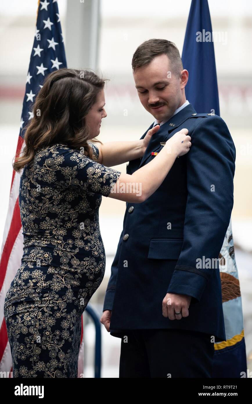 Air Force 2nd Lt. David Laird, Class Leader, has his wings pinned by ...