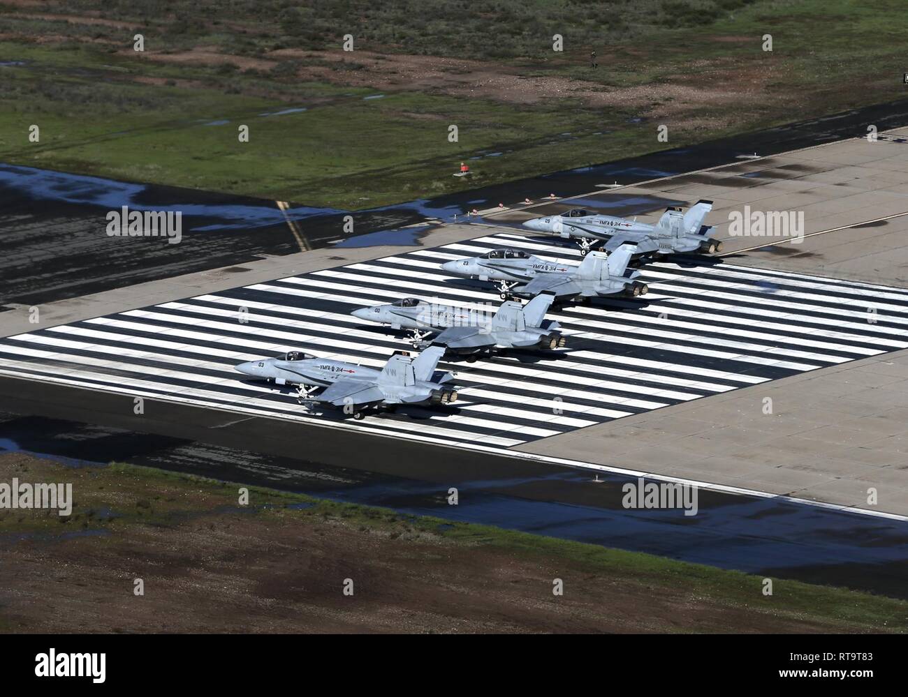 Four F/A-18 Hornets with Marine Fighter Attack Squadron (VMFA) 314 ...