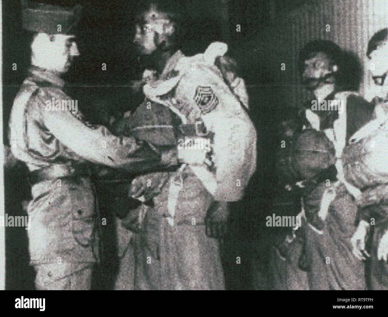 Then-1st. Sgt. Walter Morris, right, prepares for his first jump with ...