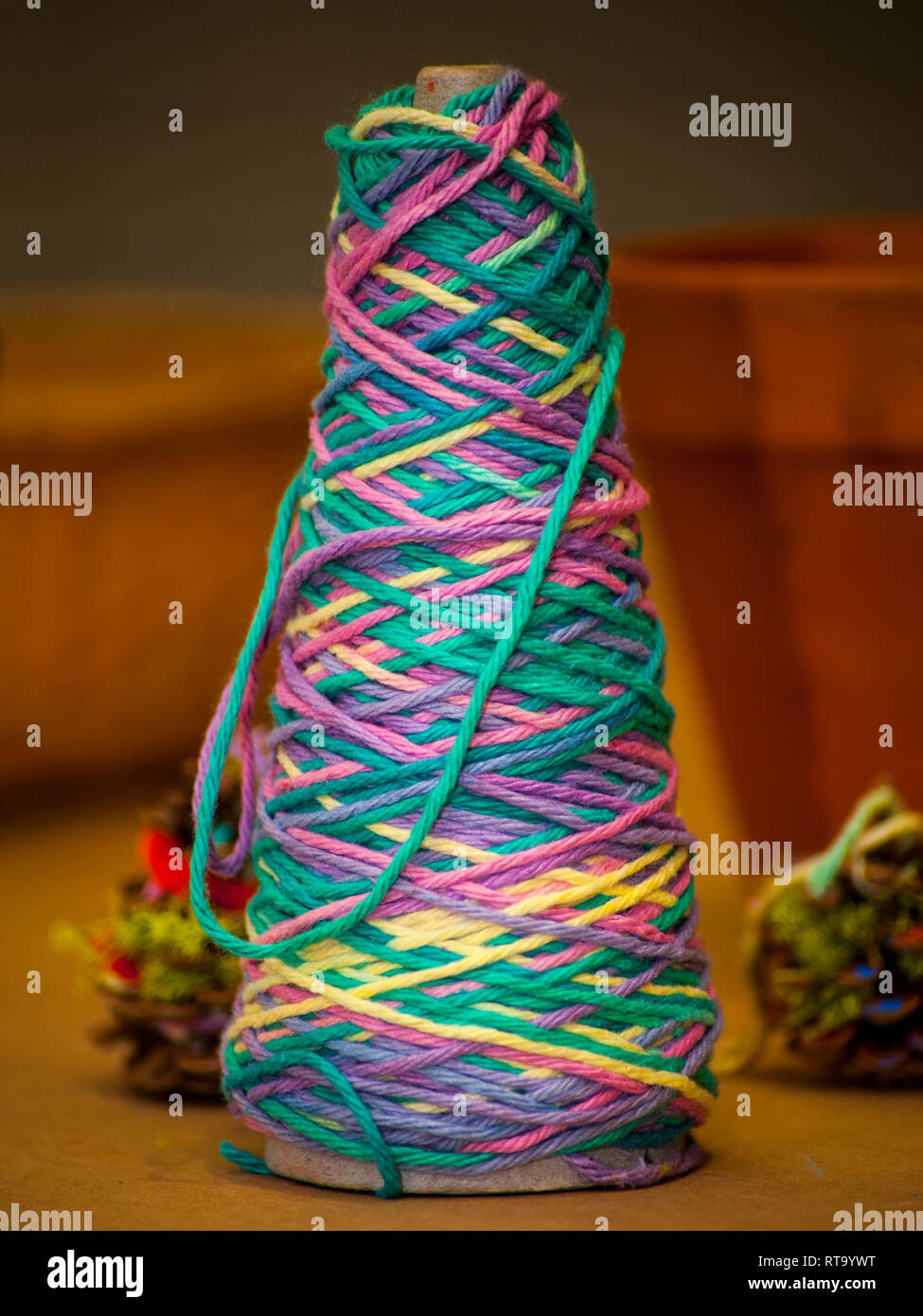 Colored twine on a spindle on a work table, Des Moines, Iowa Stock ...