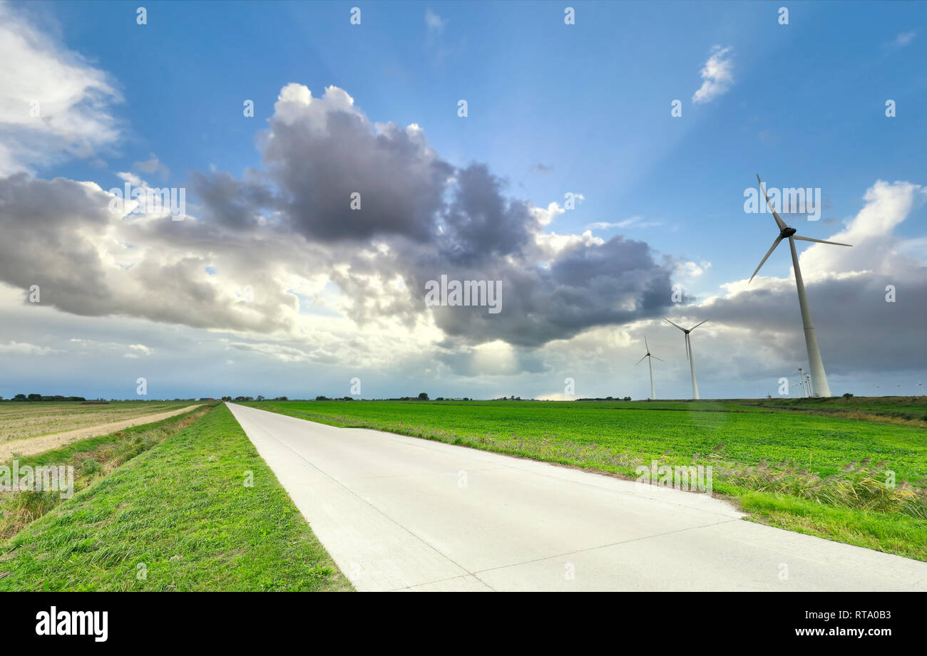 road, wind turbines, blue sky, Holland Stock Photo - Alamy