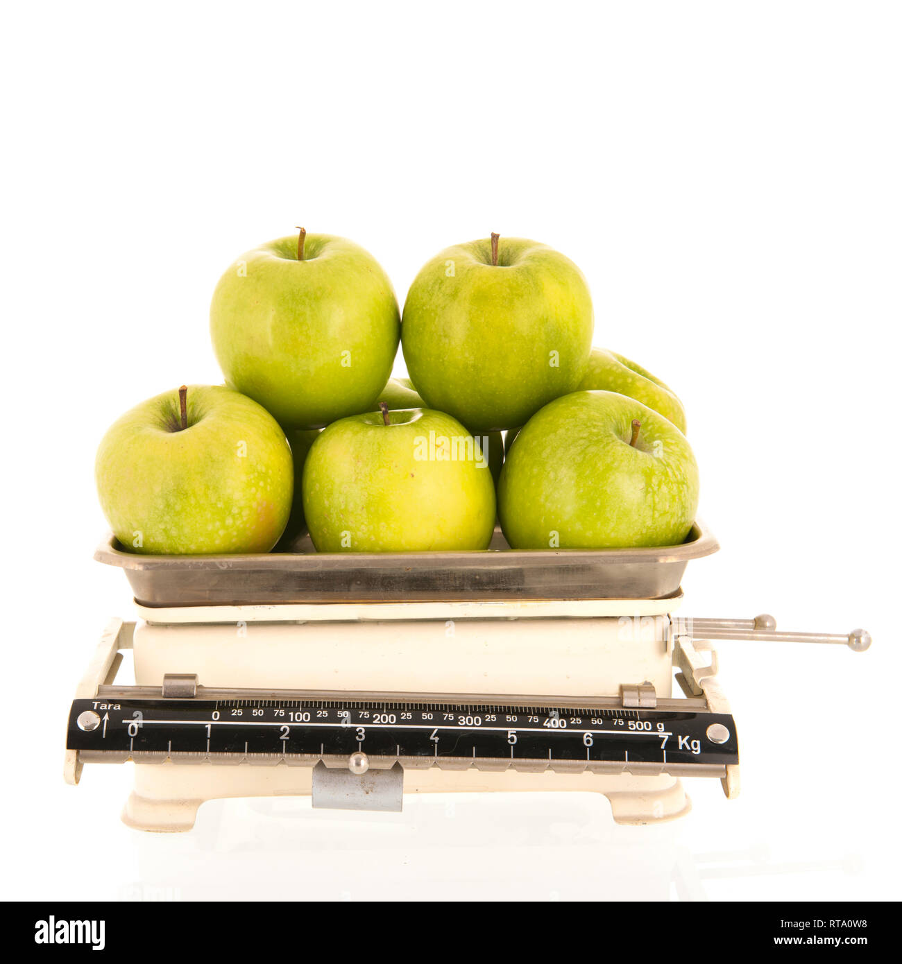 Kitchen weight scale fresh green apples isolated over white background ...
