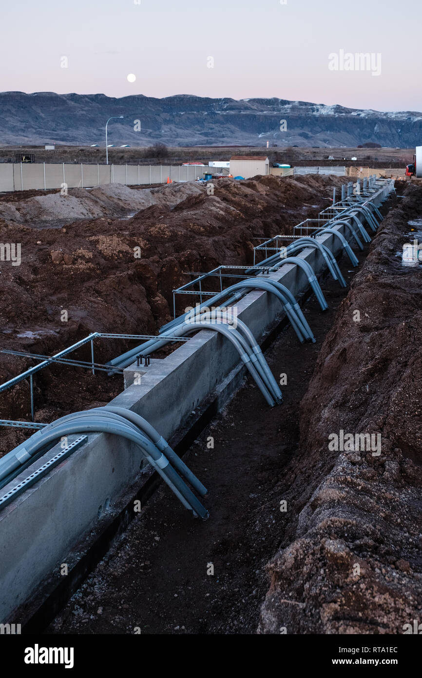 Electrical conduit is being installed in the foundation of what will ...