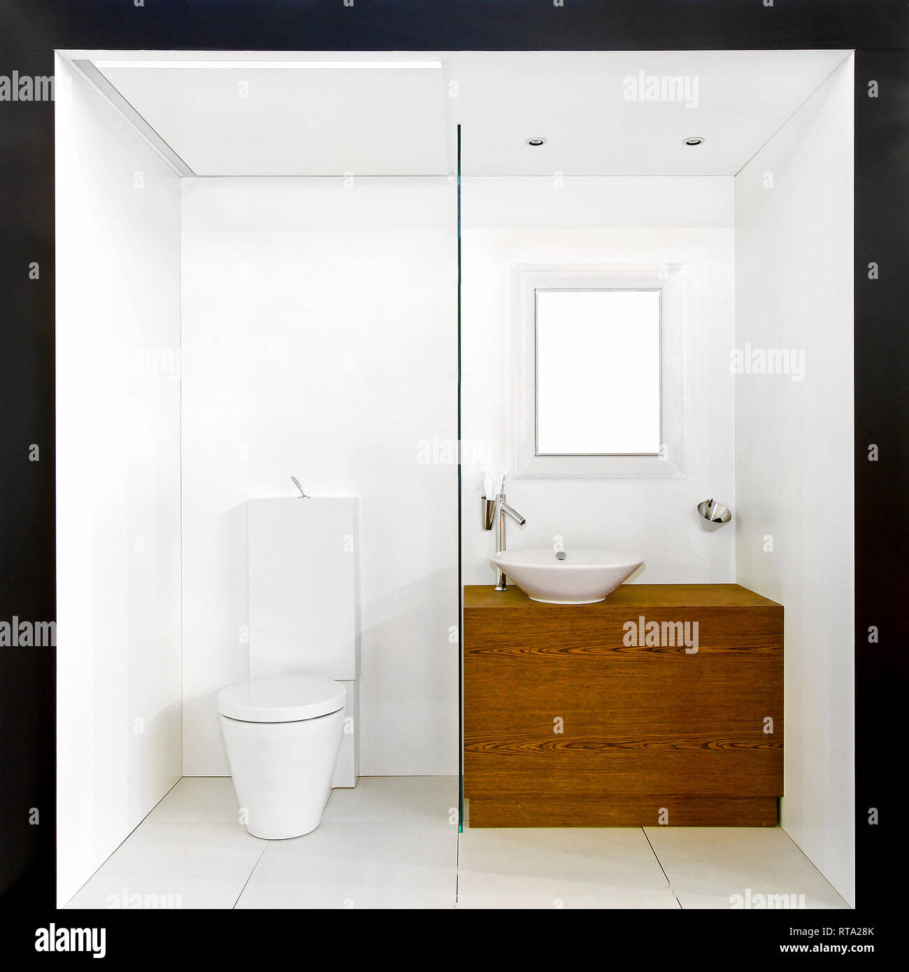 Modern white bathroom in boxed display Stock Photo - Alamy