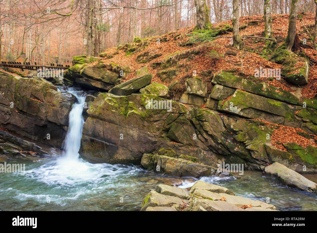 small forest waterfall in autumn. beautiful nature scenery on the river ...