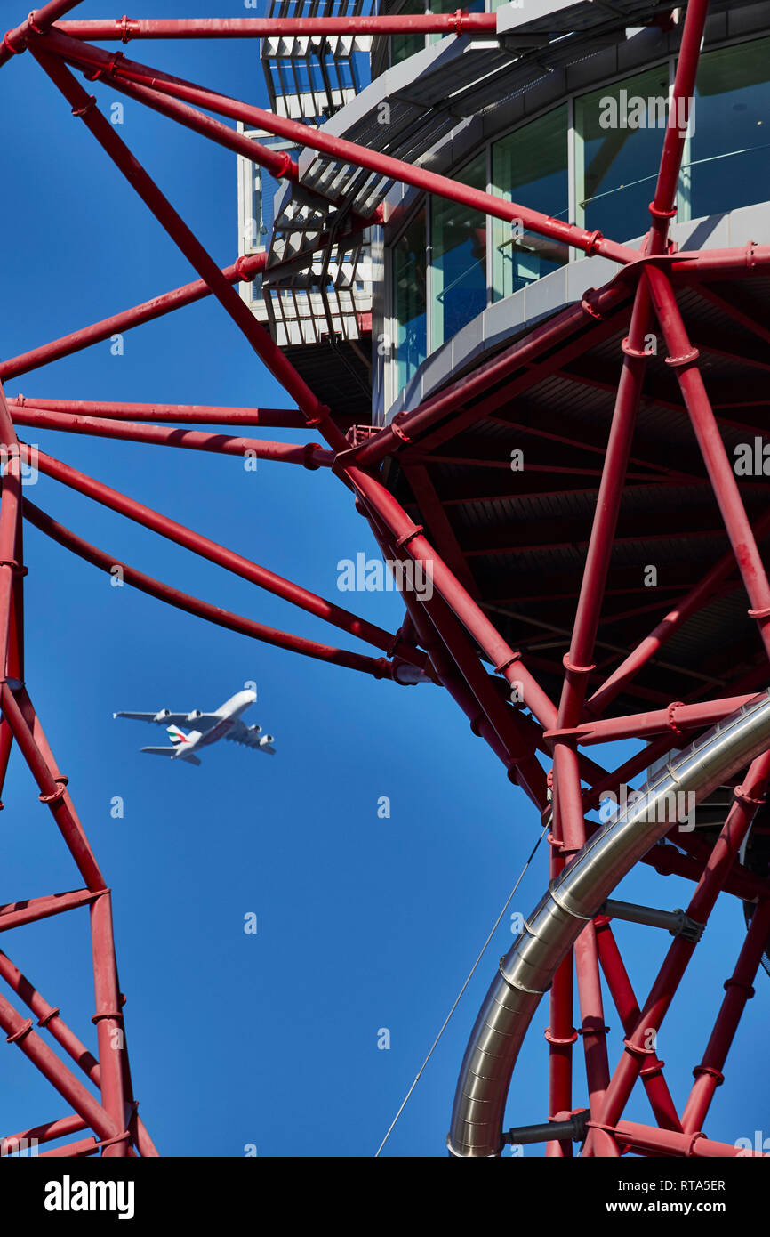 Abstract metal structure with aeroplane flying through, London, England ...
