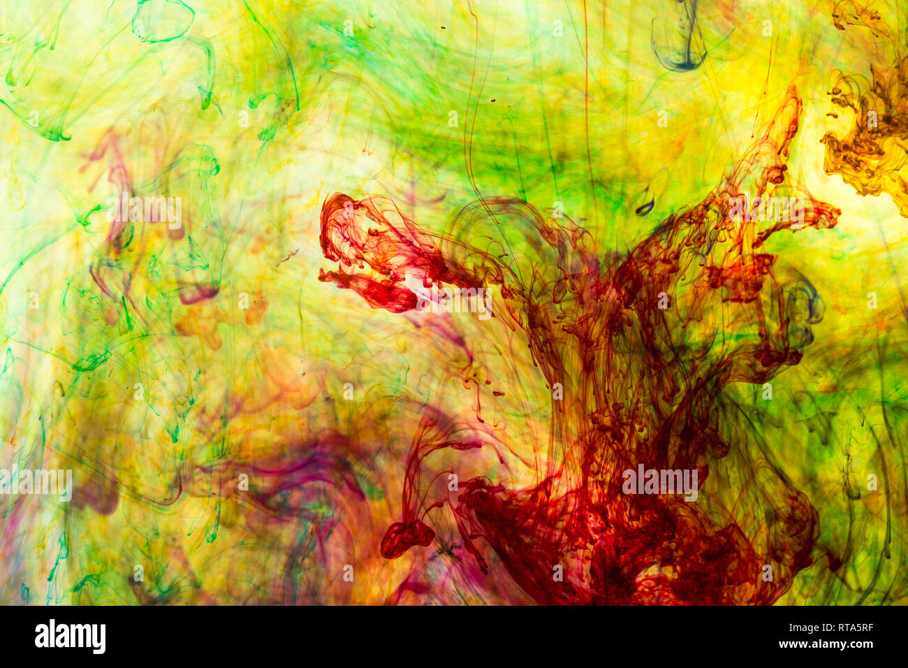 Acrylic colors and ink in water. Abstract background Stock Photo - Alamy