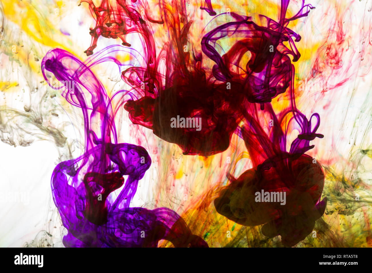 Acrylic colors and ink in water. Abstract background Stock Photo - Alamy