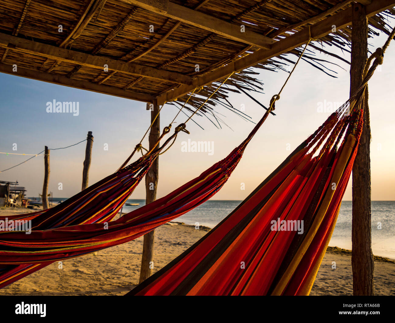 Colorful hammocks in front of the beach in Cabo de la Vela, Colombia ...