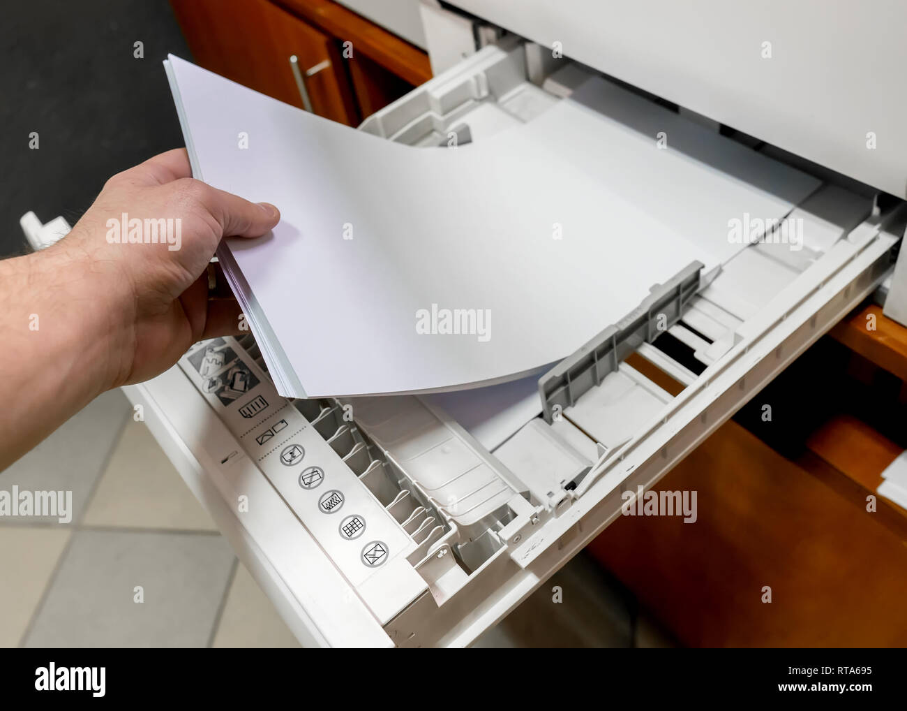 paper in printer. sets the paper stack in the laser printer Stock Photo ...