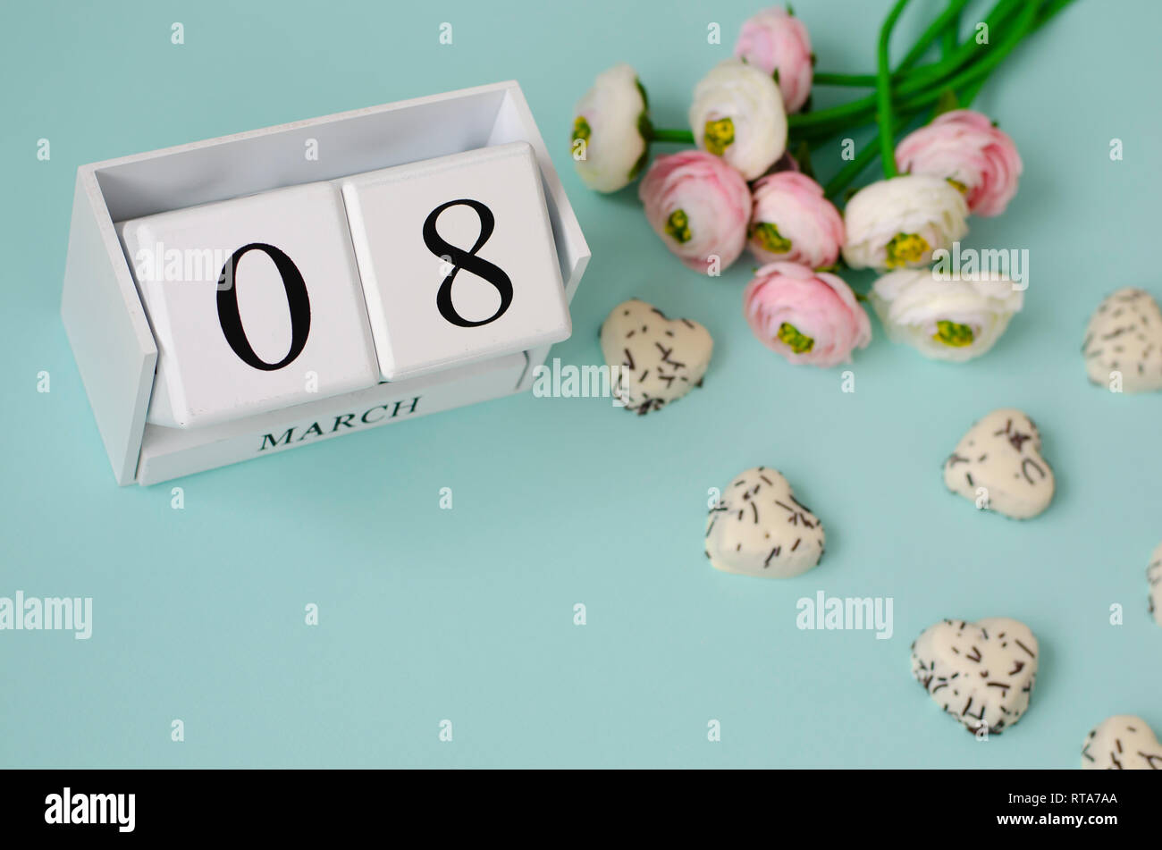 International Women's Day concept. White wooden cubes with 8 th march ...