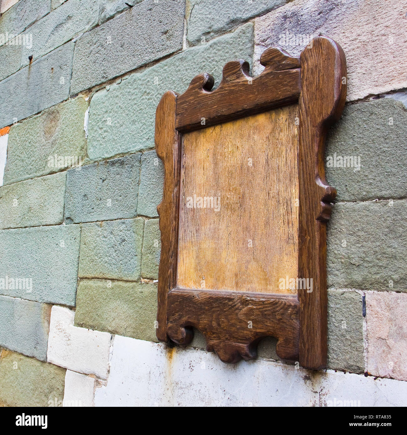 Old wooden frame against a medieval stone wall Stock Photo - Alamy