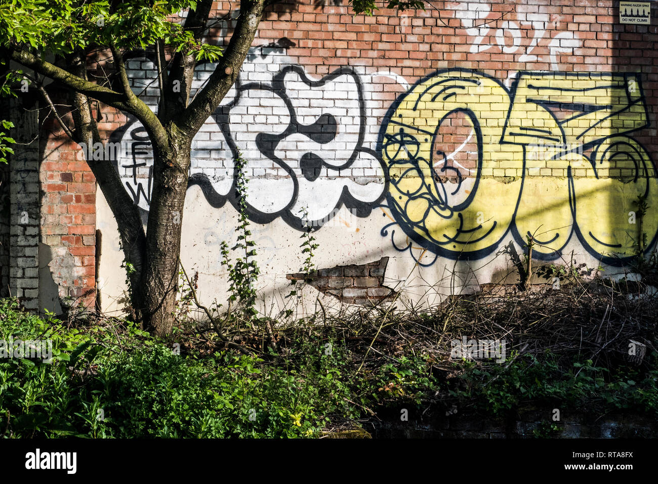 Graffiti canal wall Stock Photo - Alamy