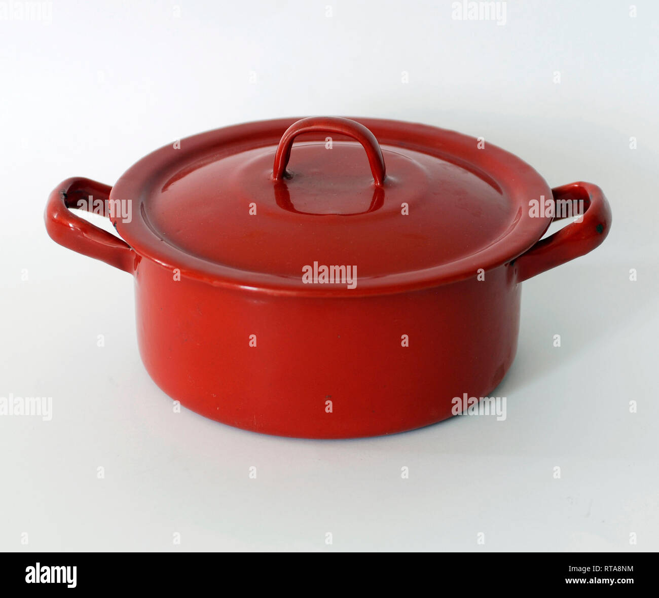 Vintage enameled metal pot in red color Stock Photo - Alamy