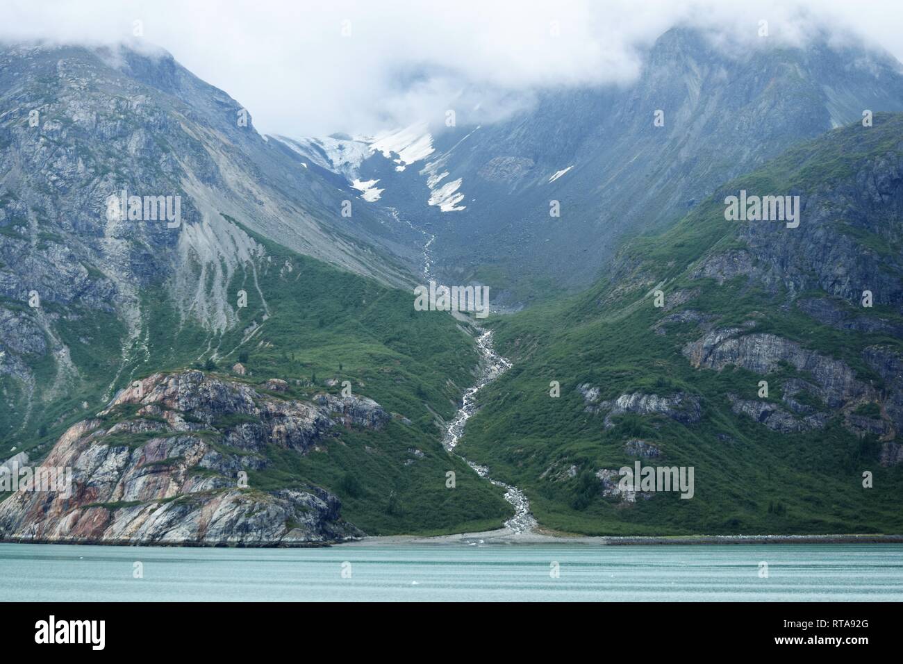 Beautiful lush green mountains surround Glacier Bay, Alaska Stock Photo ...