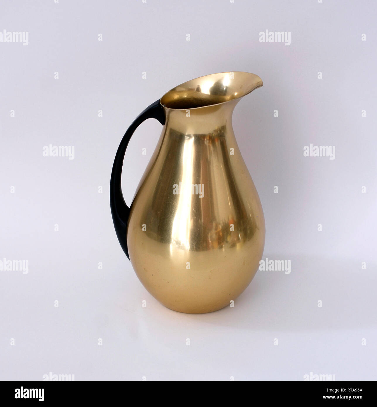 Vintage gold colored anodized aluminum jug Stock Photo - Alamy