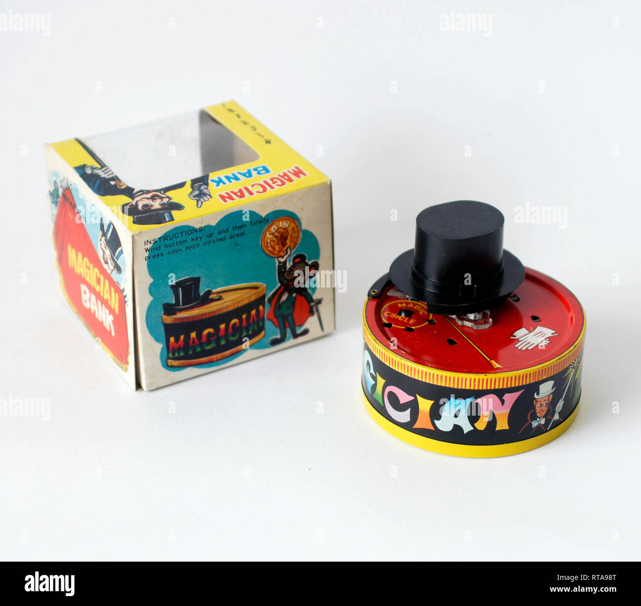 Vintage tin toy magician bank Stock Photo - Alamy